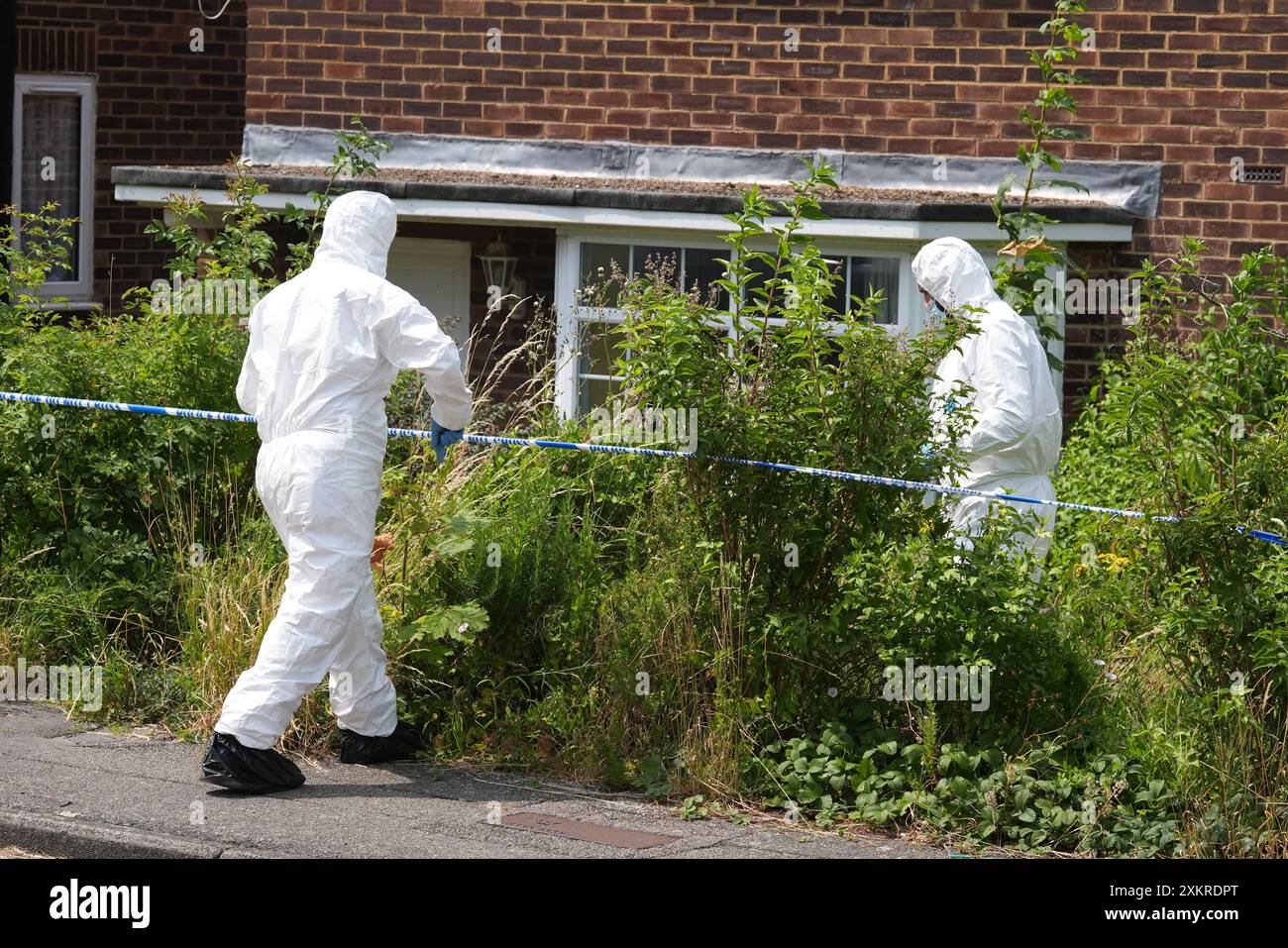 Forensic officers on Mooring Road, Rochester in Kent, where a moped was ...