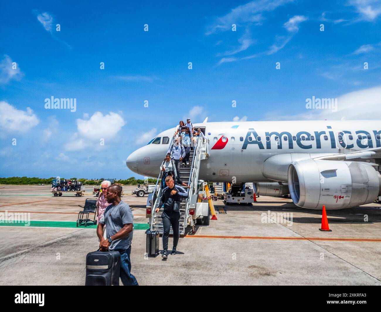 Passengers getting off American Airlines flight at Cyril E. King ...