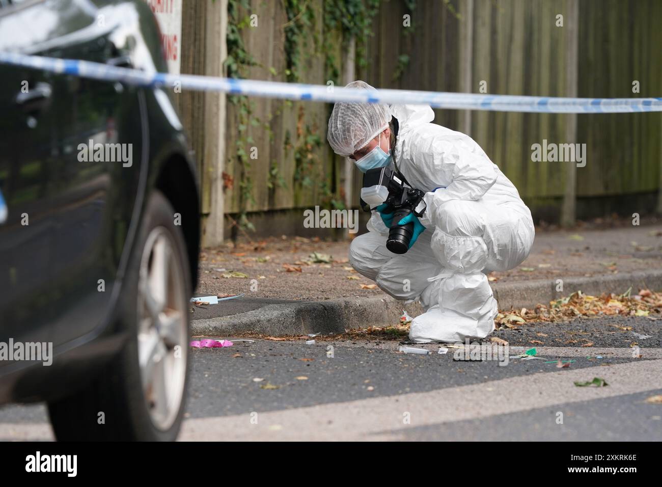 A forensic officer at the scene near Sally Port Gardens in Gillingham ...