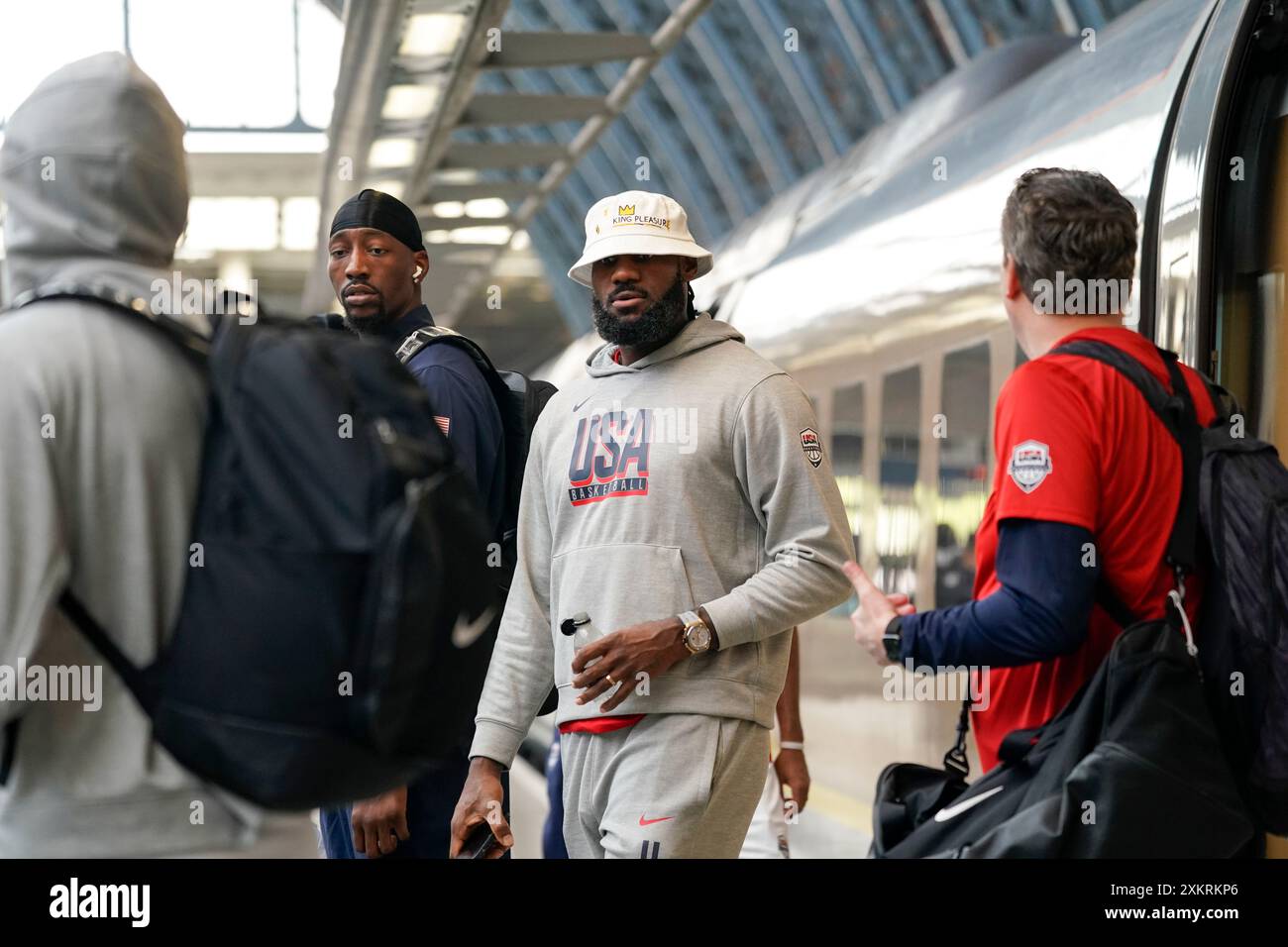 United States' LeBron James, centre, arrives at St Pancras Station with ...