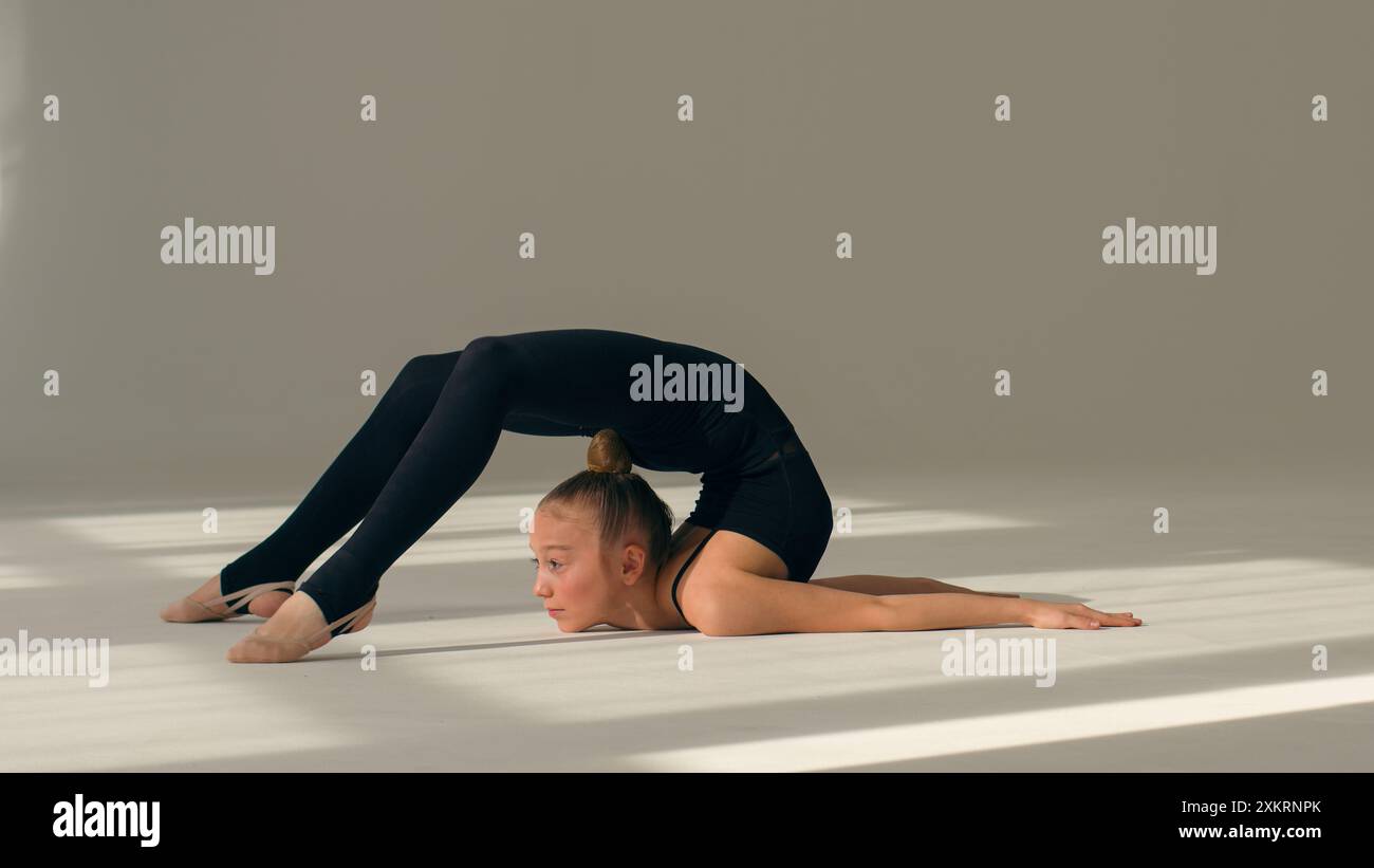 Caucasian sport girl little kid child daughter schoolgirl gymnast ...