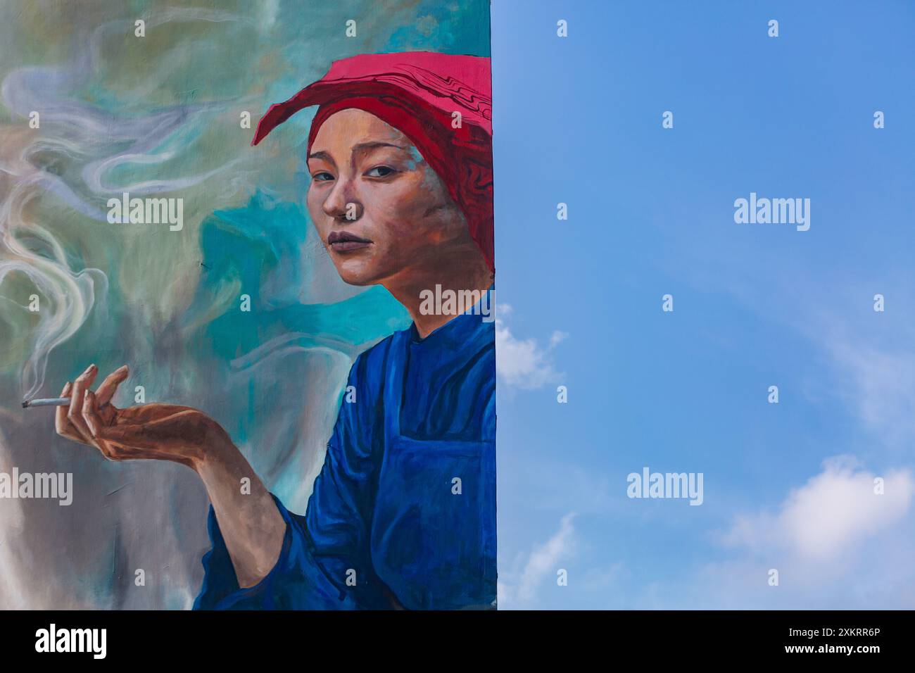 Wall mural of a Samsui woman and the blue sky. Chinatown, Singapore ...