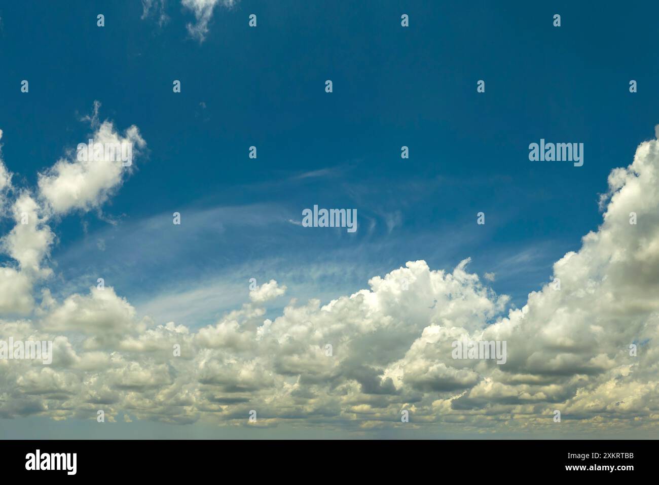 Blue sky with white clouds. Bright summer skyscape Stock Photo - Alamy