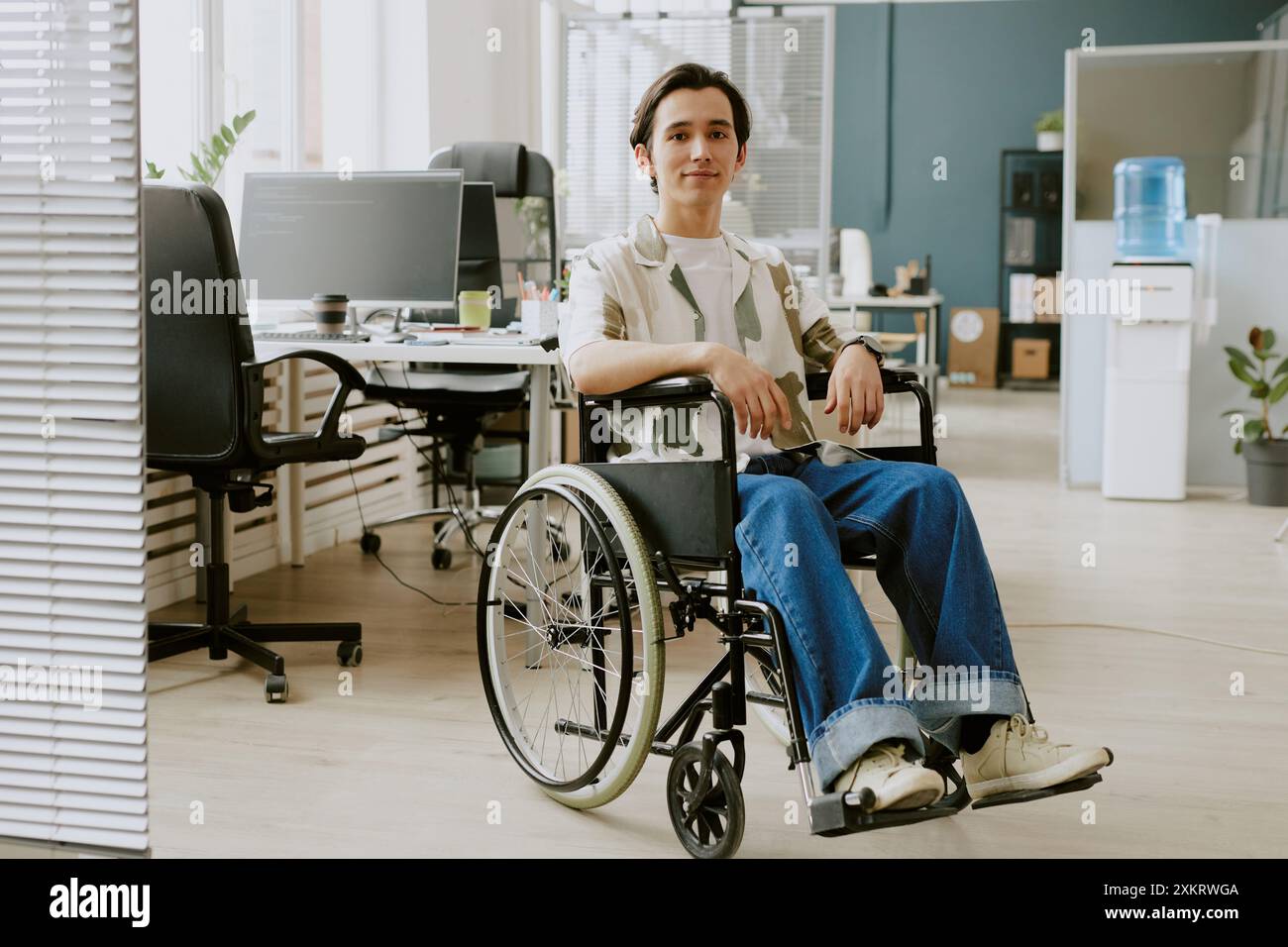 Portrait of modest highly experienced programmer with disability ...