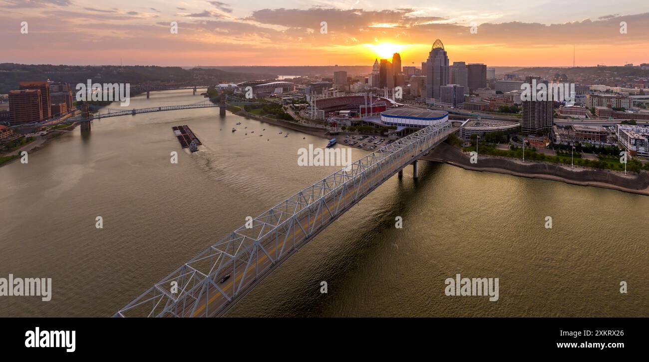 Driving cars on bridge highway near illuminated high skyscraper ...