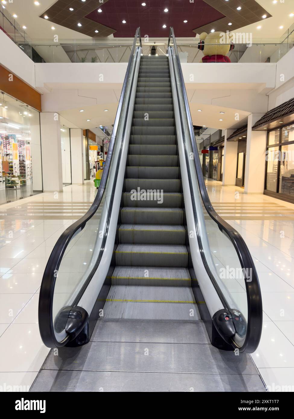 Empty escalator metal steps inside of building Stock Photo - Alamy
