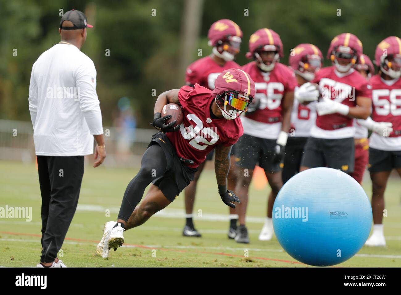 Washington Commanders linebacker Mykal Walker takes part in drills ...