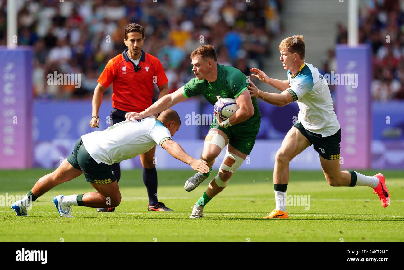 Ireland's Zac Ward is tackled by South Africa's South Africa's Zain ...