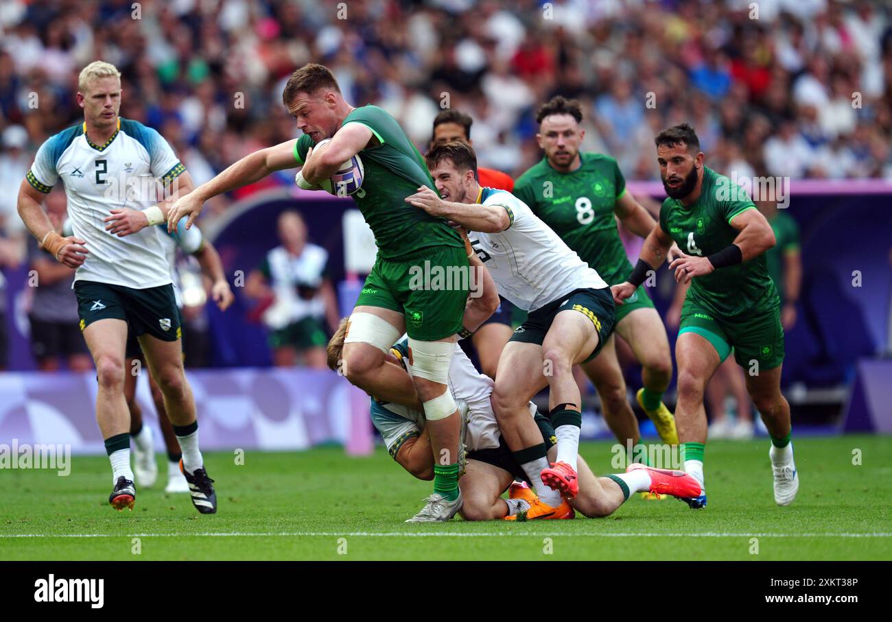 Ireland's Zac Ward is tackled by South Africa's Quewin Nortje during ...