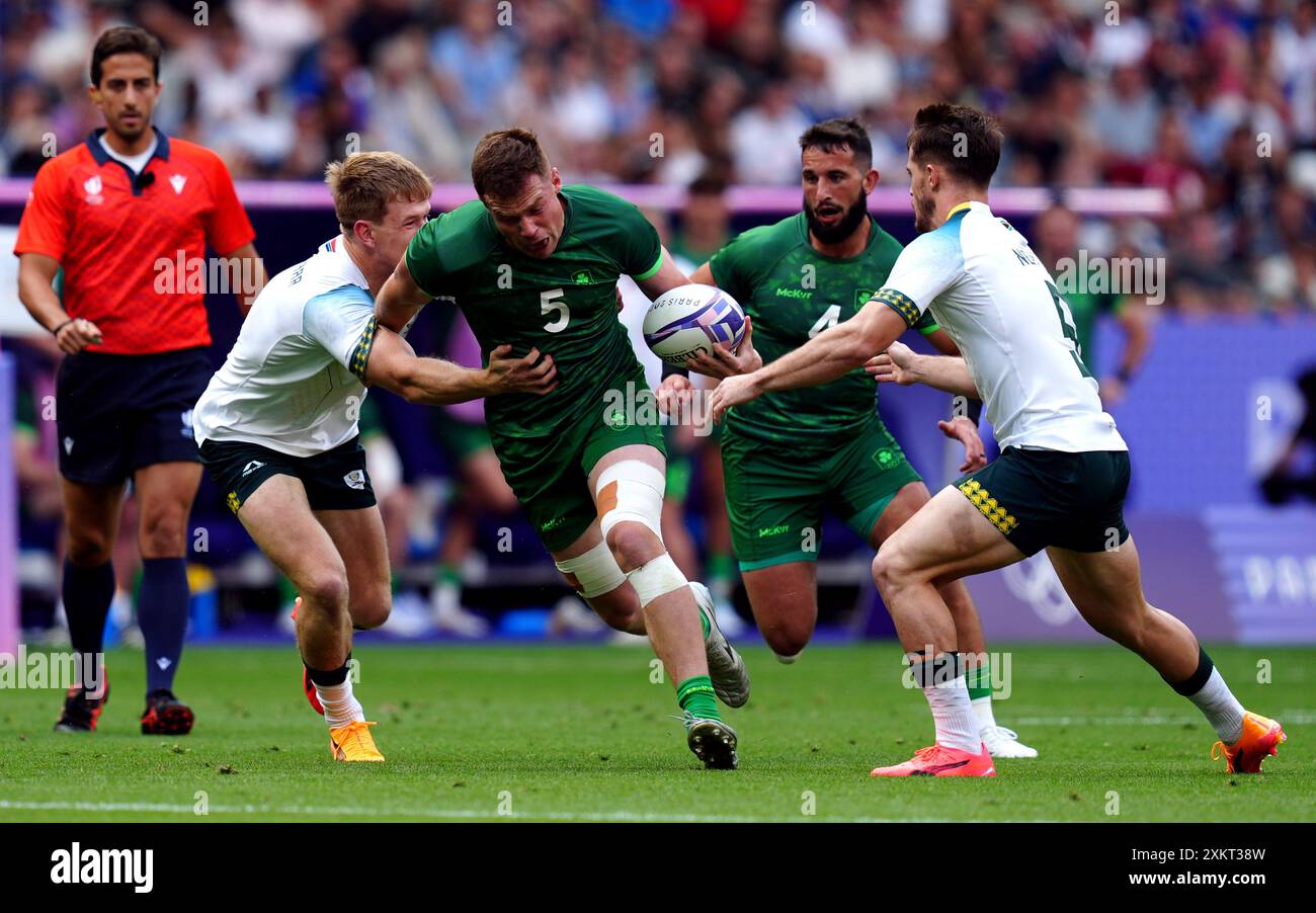 Ireland's Zac Ward is tackled by South Africa's Quewin Nortje (right ...