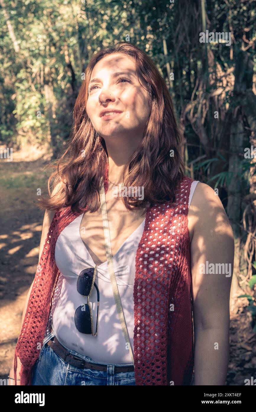 Brazilian woman enjoys the sun when she take a walk in the Botanical ...