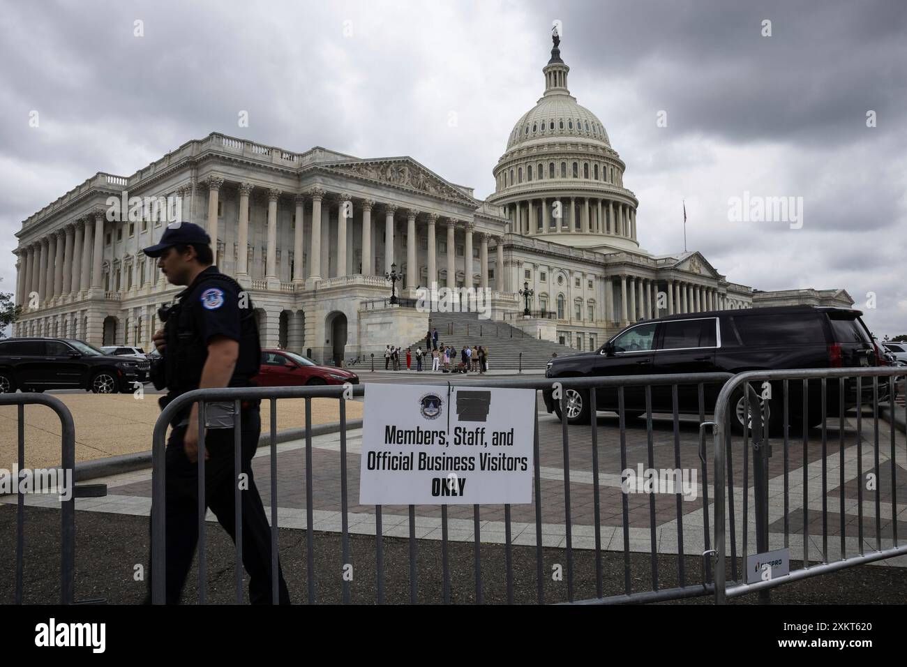 A U.S. Capitol Police officer guards the U.S. Capitol building hours ...