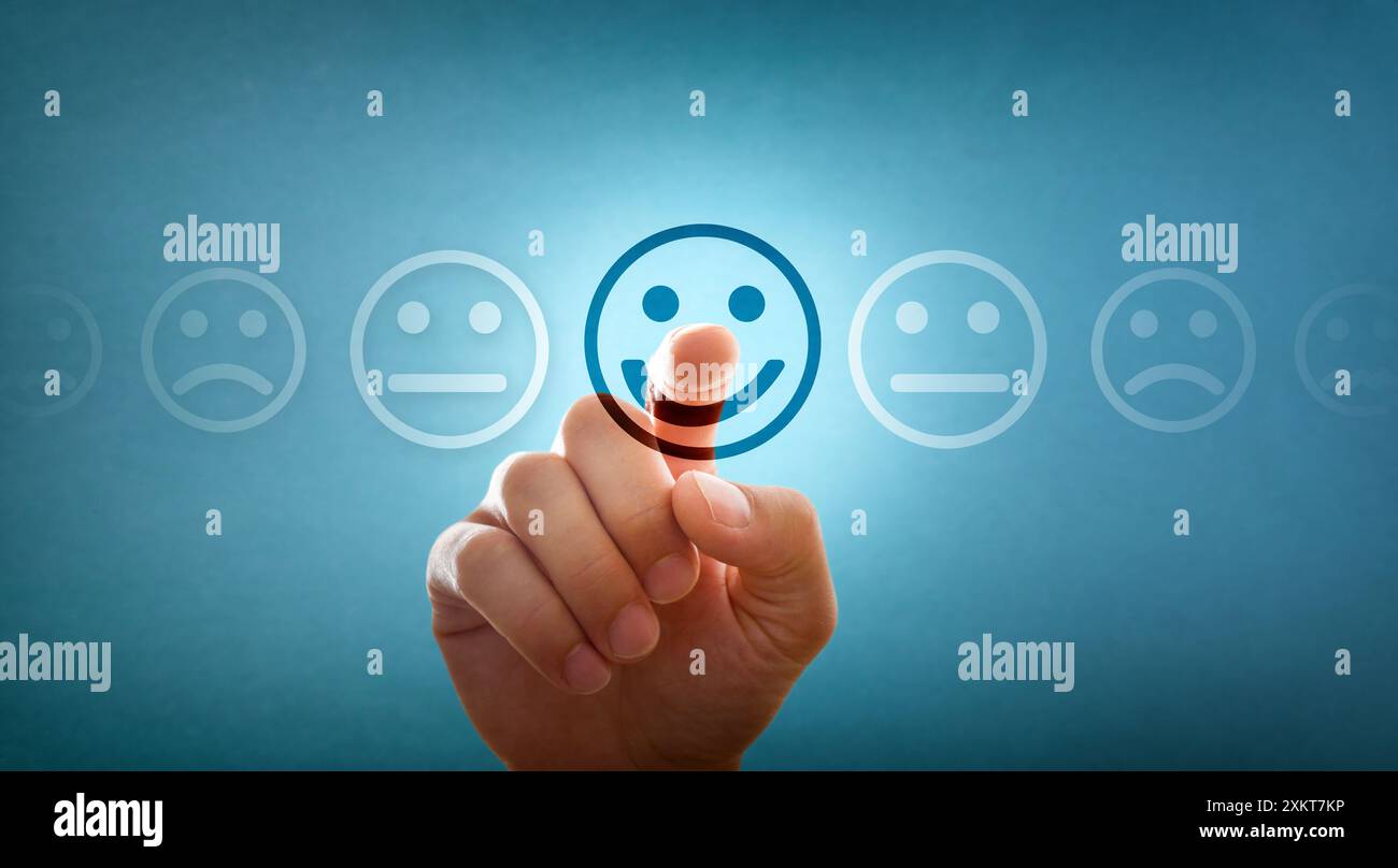 Hand selecting happy emoticon from various options such as positive ...