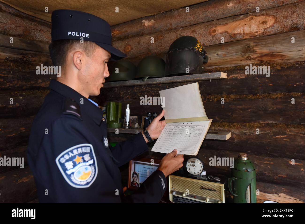 (240724) -- BURQIN, July 24, 2024 (Xinhua) -- A police officer shows ...