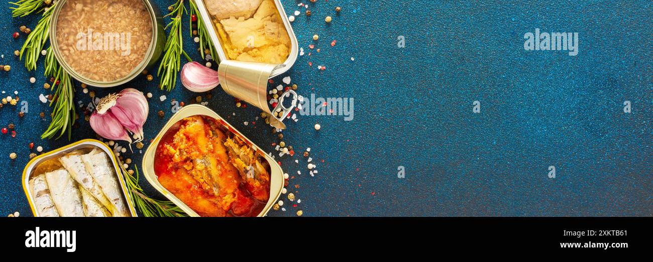 Different open tin cans with canned fish like salmon, mackerel, sprat ...