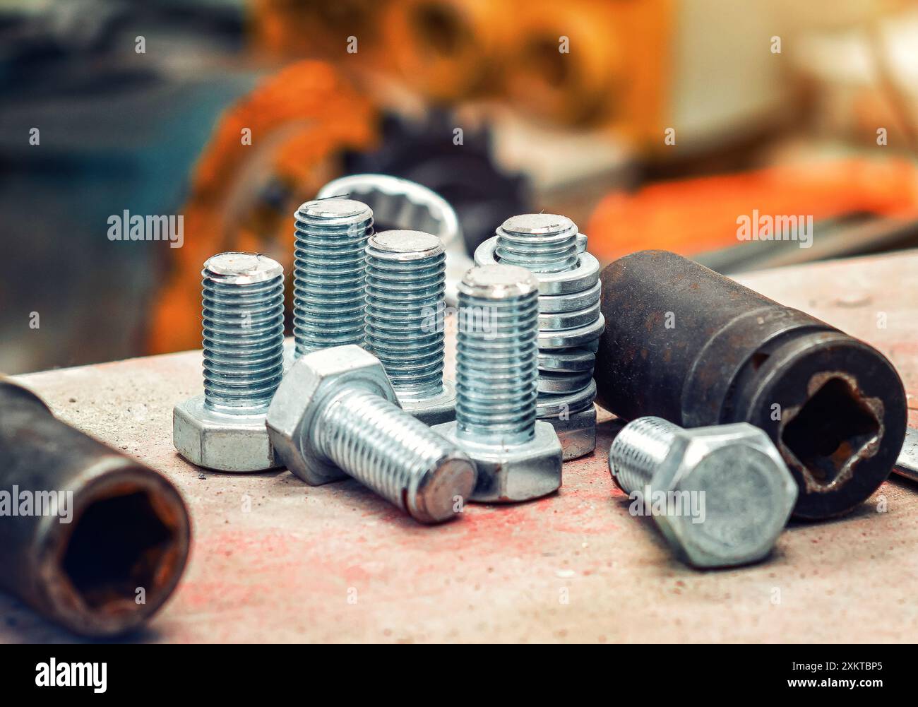 Assortment steel screws close-up. Set of bolts on blurred workshop ...