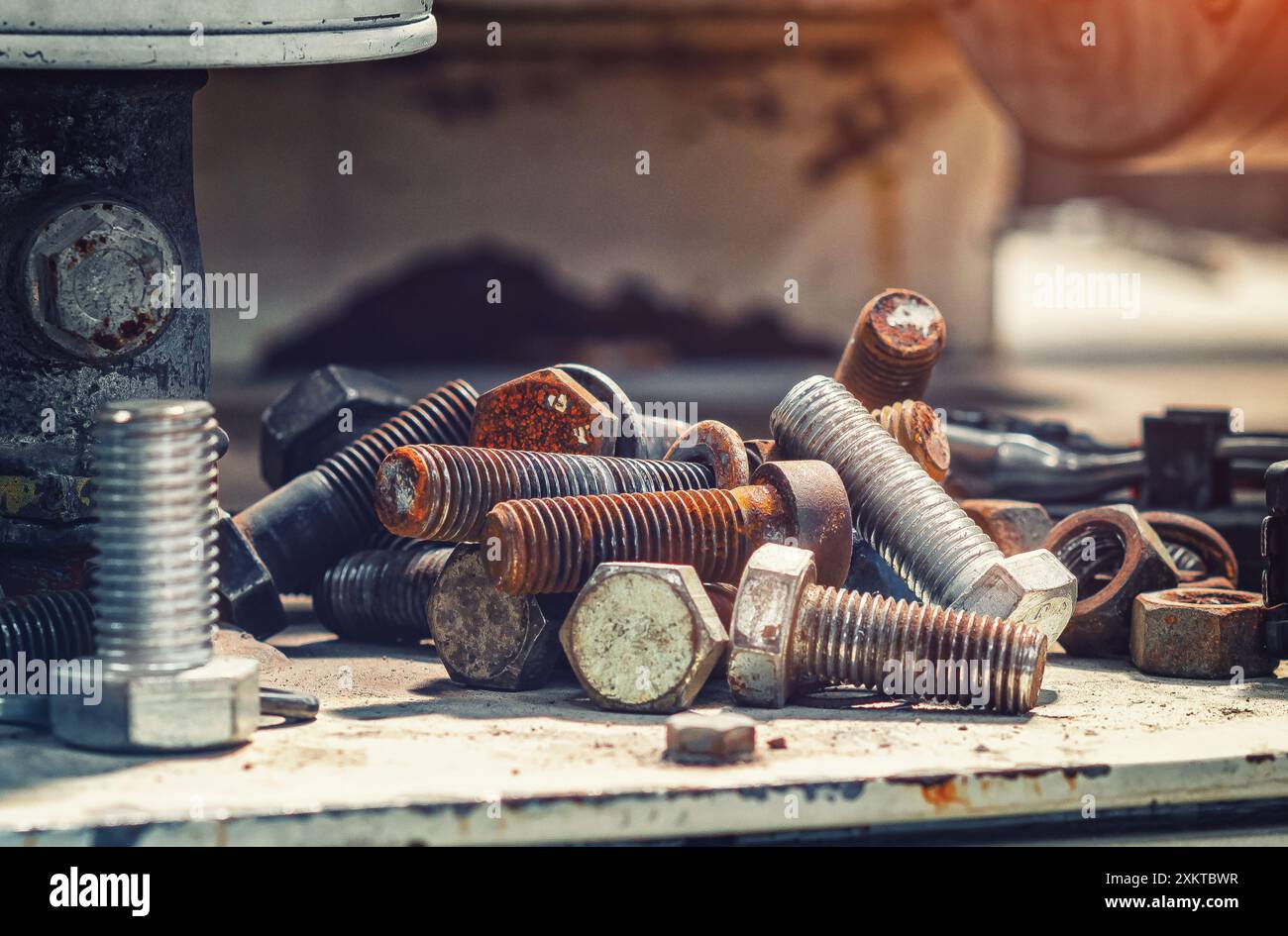 Assortment steel screws close-up. Set of bolts on blurred workshop ...