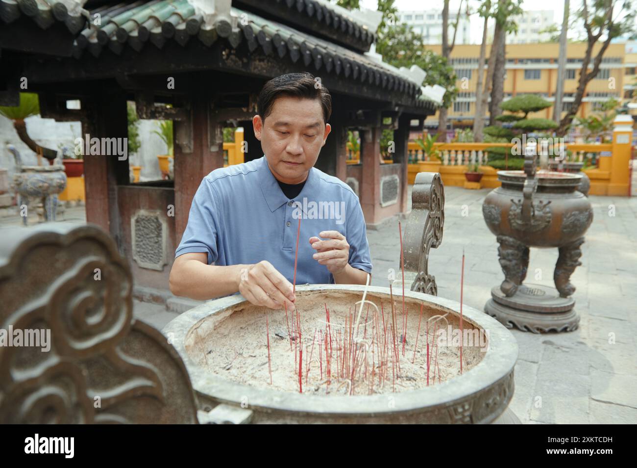 Buddhist Using Aroma Sticks In Pray Stock Photo - Alamy
