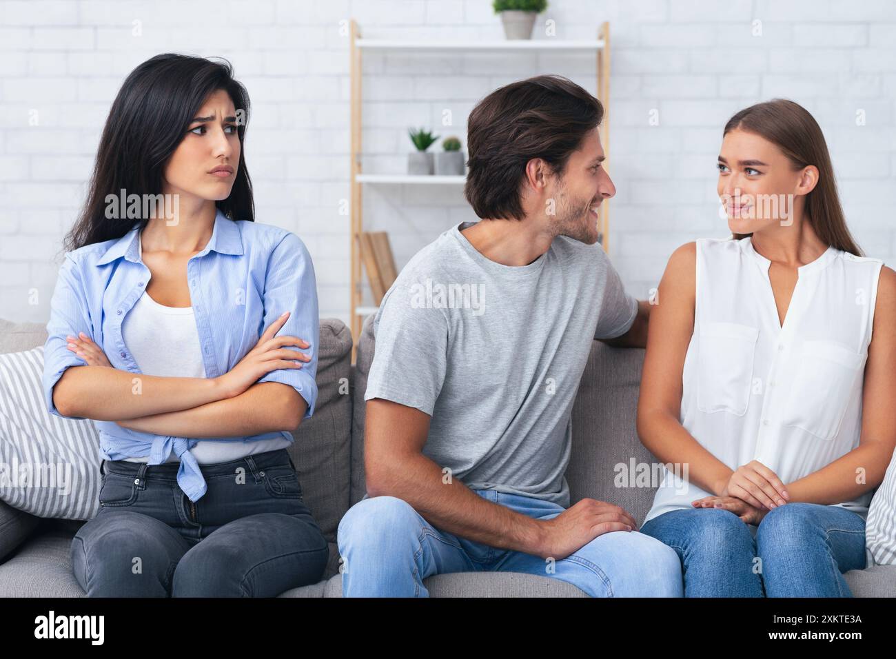 Jealousy And Cheating. Sad Girl Looking At Her Boyfriend Flirting With ...