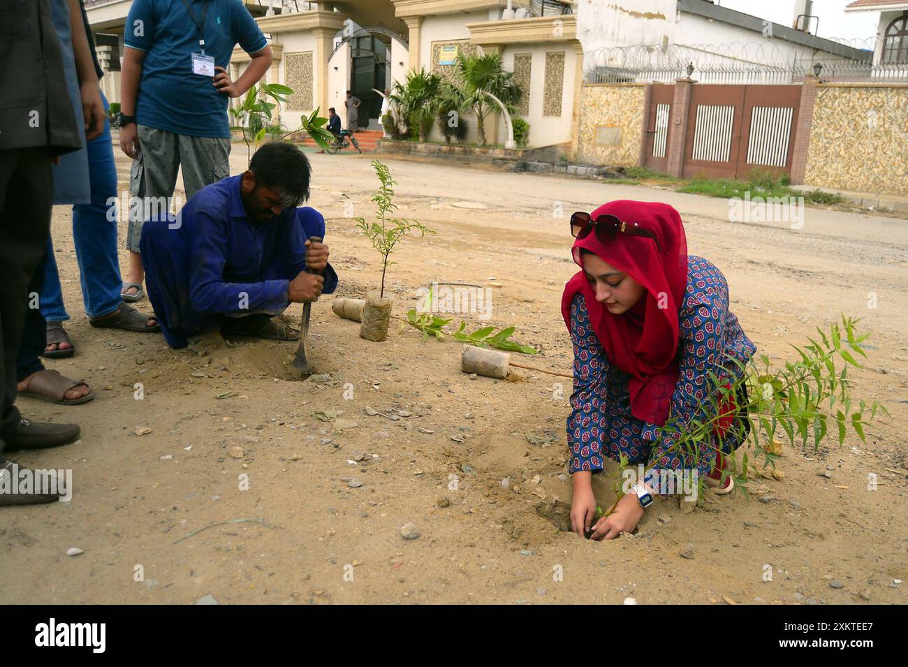 KARACHI, PAKISTAN, 24/07/2024, Participants are planting a sapling ...