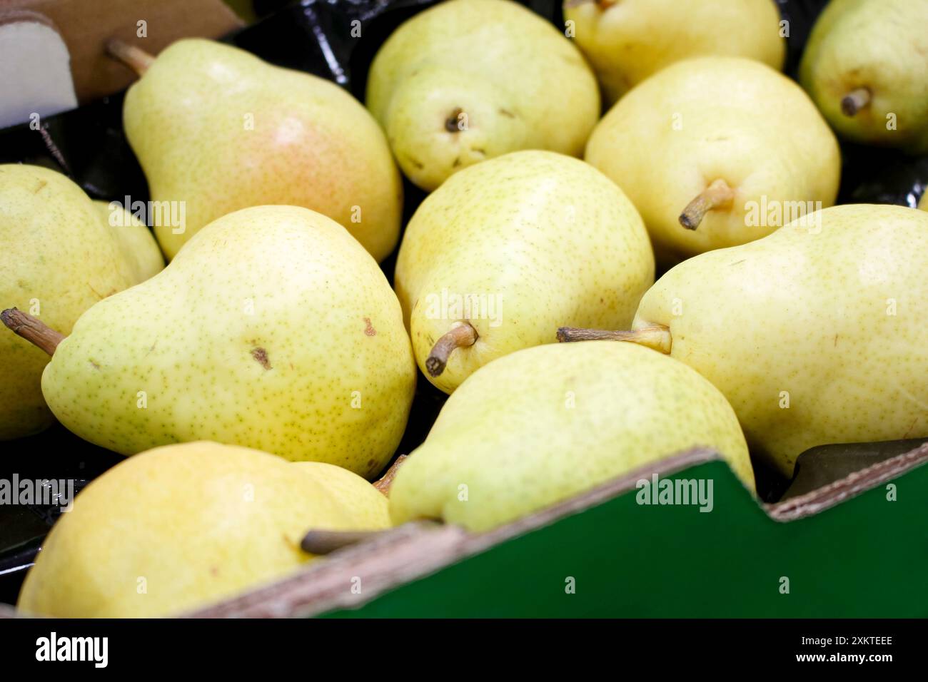 A view of a case of Bartlett pears, on display at a local grocery store ...