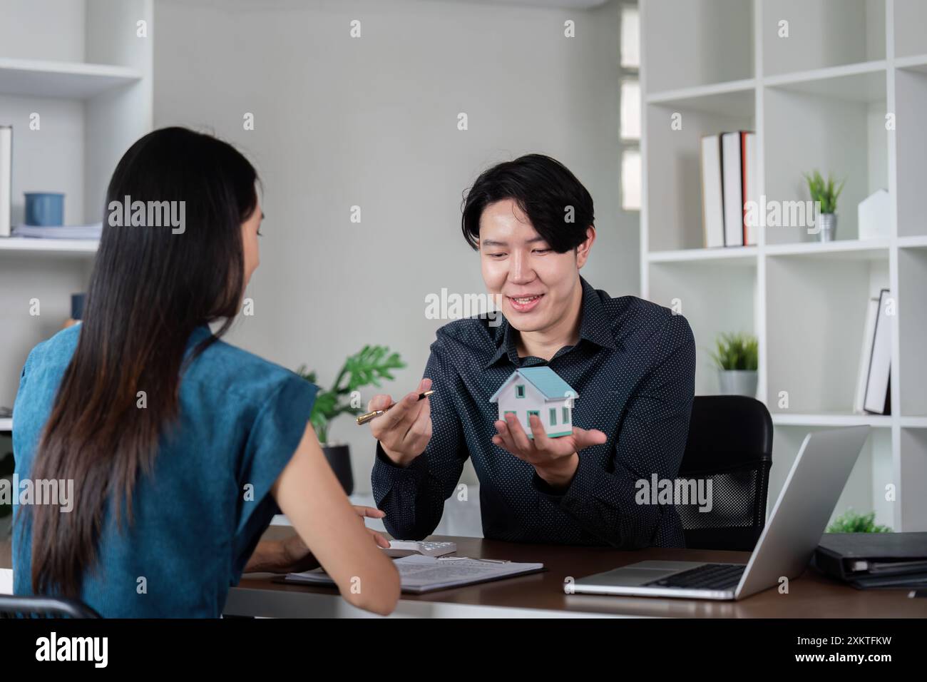 Real Estate Agent Discussing Property Details with Client in Modern ...