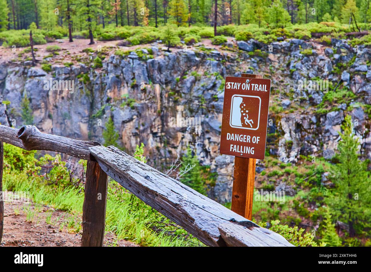 Rugged Cliffside Hiking Trail with Warning Sign and Safety Railing ...