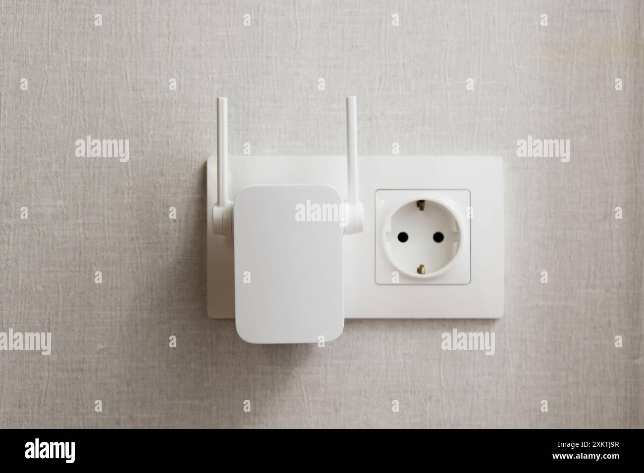WiFi Range Extender Plugged into Wall Outlet on Textured Background ...