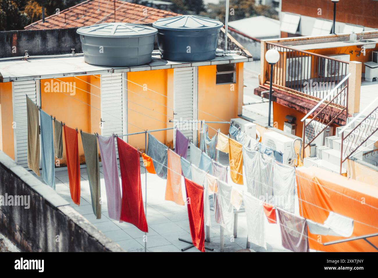 Clothes and towels hanging to dry on a rooftop laundry area of a ...