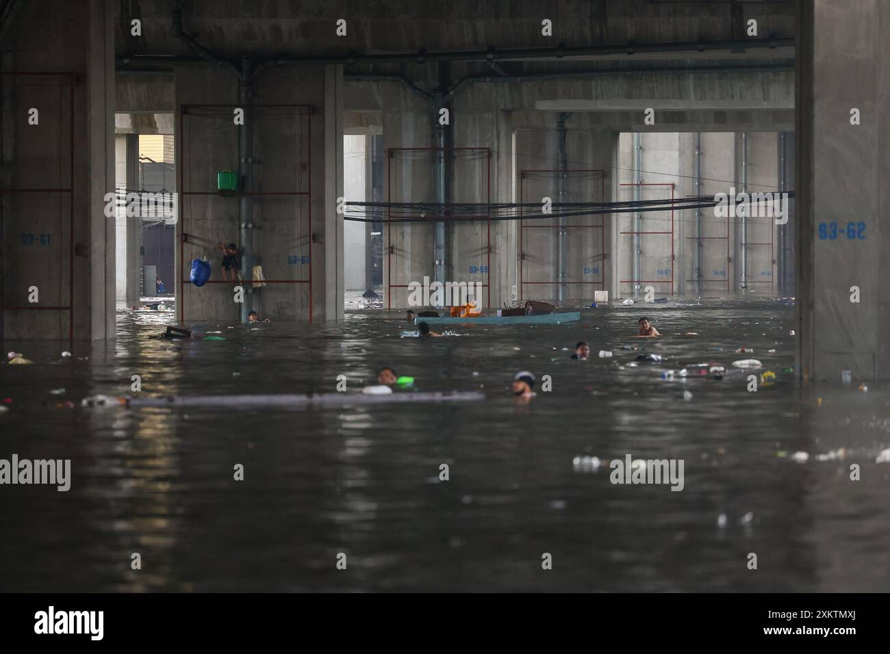 July 24, 2024, Quezon City, Metro Manila, Philippines: People wade ...