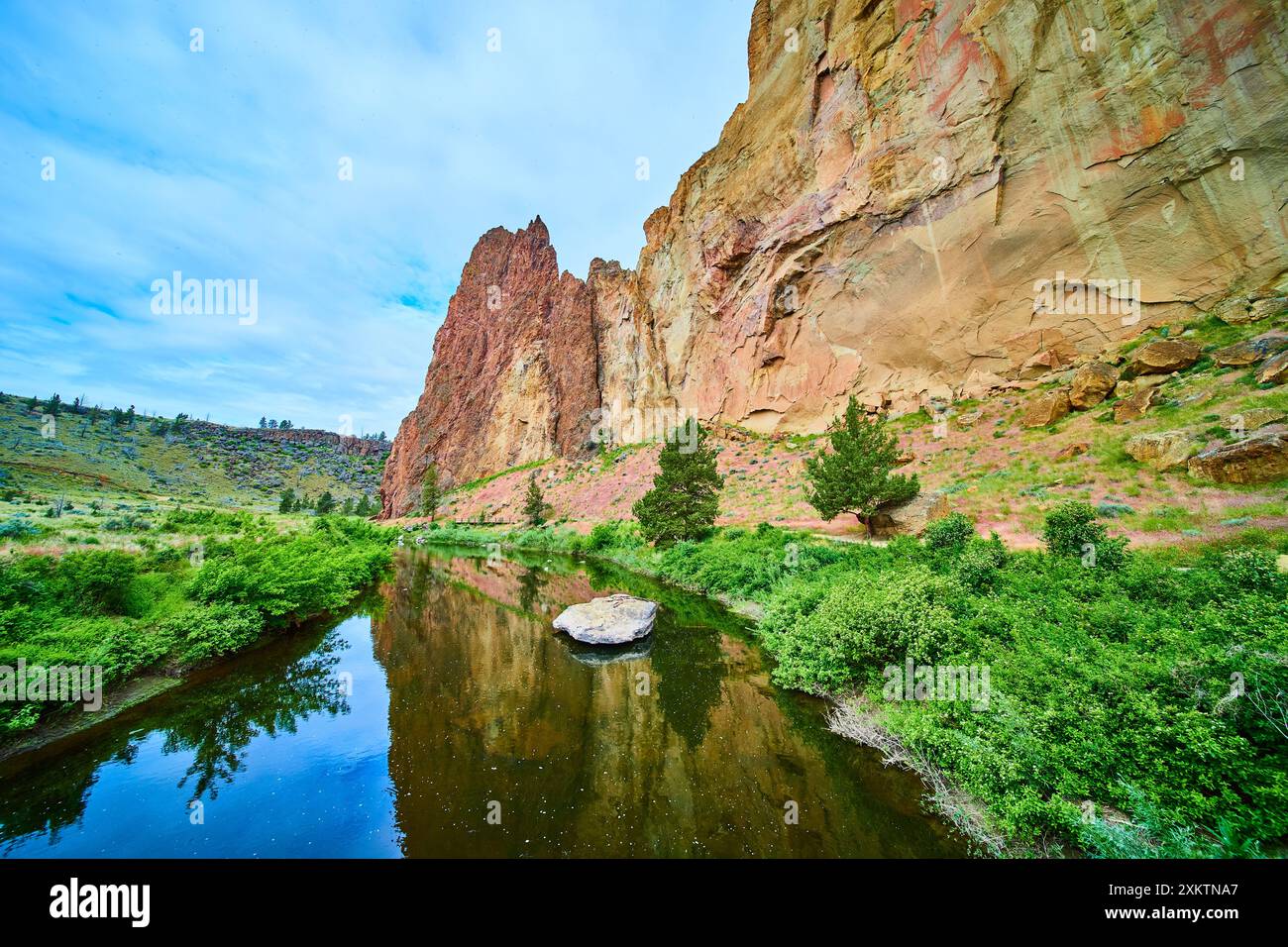 Rugged Cliff and Tranquil River in Smith Rock State Park from Riverbank ...