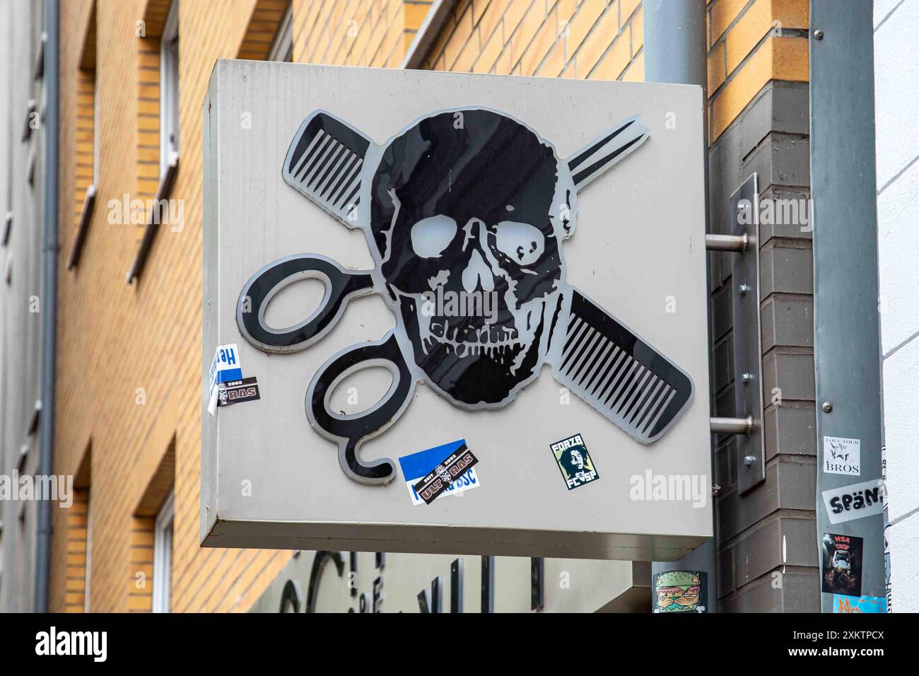 Skull with crossed comb and scissors on Pauli Schnitt barber shop ...