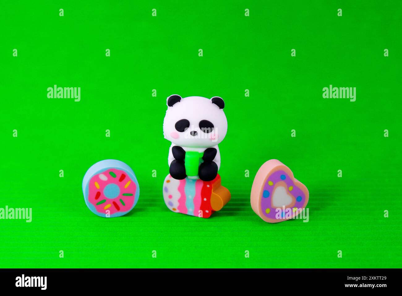 Panda bear enjoying various sweets Stock Photo - Alamy