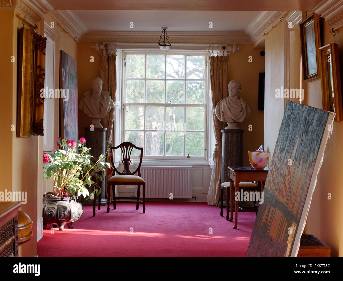 Hallway with artowrk and statues inside historic Colstoun House near ...