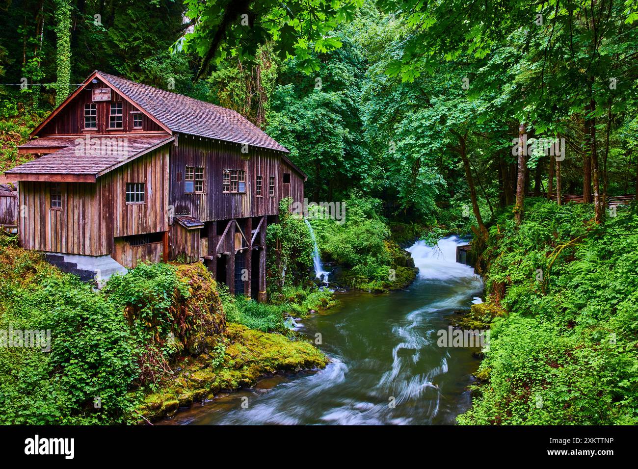 Historic Cedar Creek Grist Mill in Lush Forest Aerial Tilt Stock Photo ...