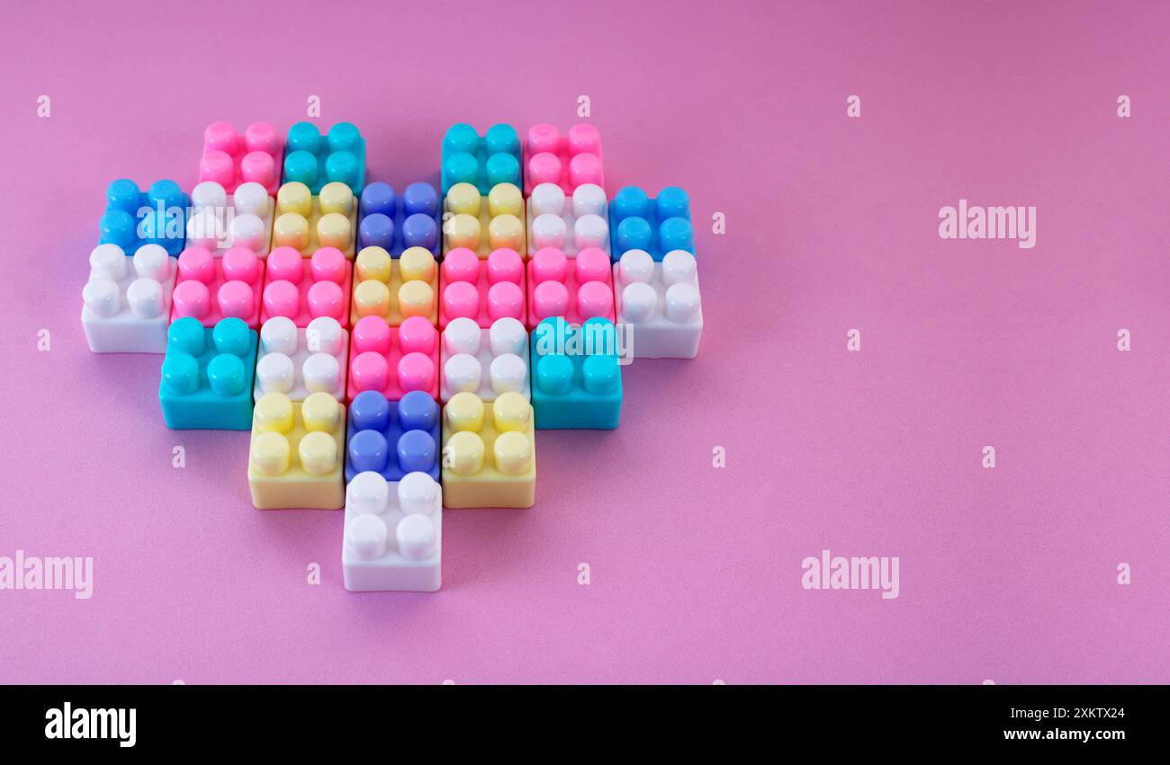 Colorful puzzle blocks forming heart - horizontal format Stock Photo ...