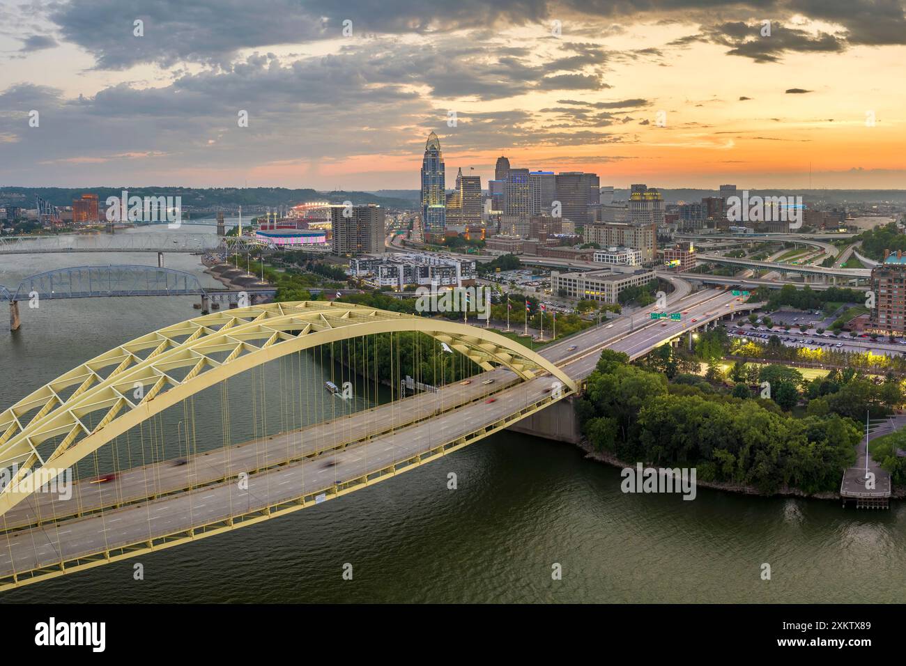Downtown district of Cincinnati city in Ohio, USA at night with driving ...