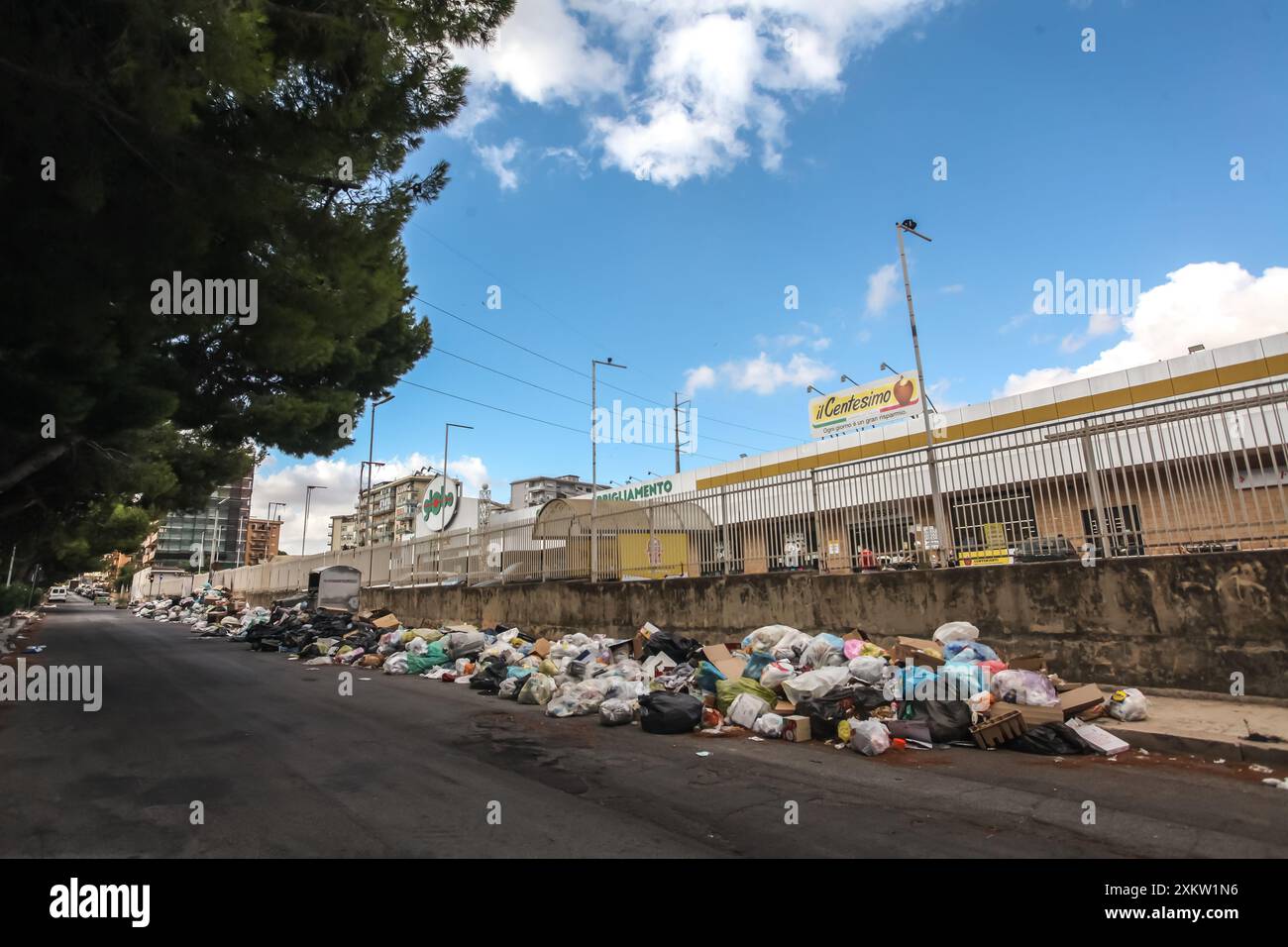 Dumpsters overflowing with waste in Palermo, Italy Stock Photo - Alamy