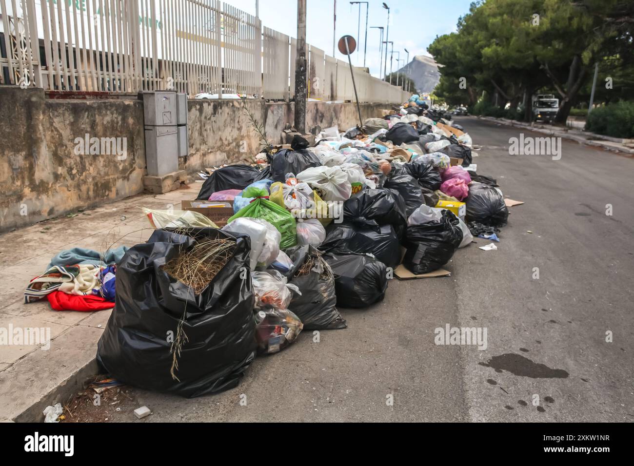 Dumpsters overflowing with waste in Palermo, Italy Stock Photo - Alamy