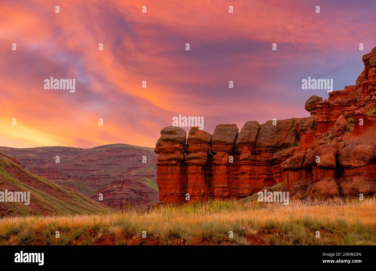 Red fairy chimneys shaped like formations that are millions of years ...