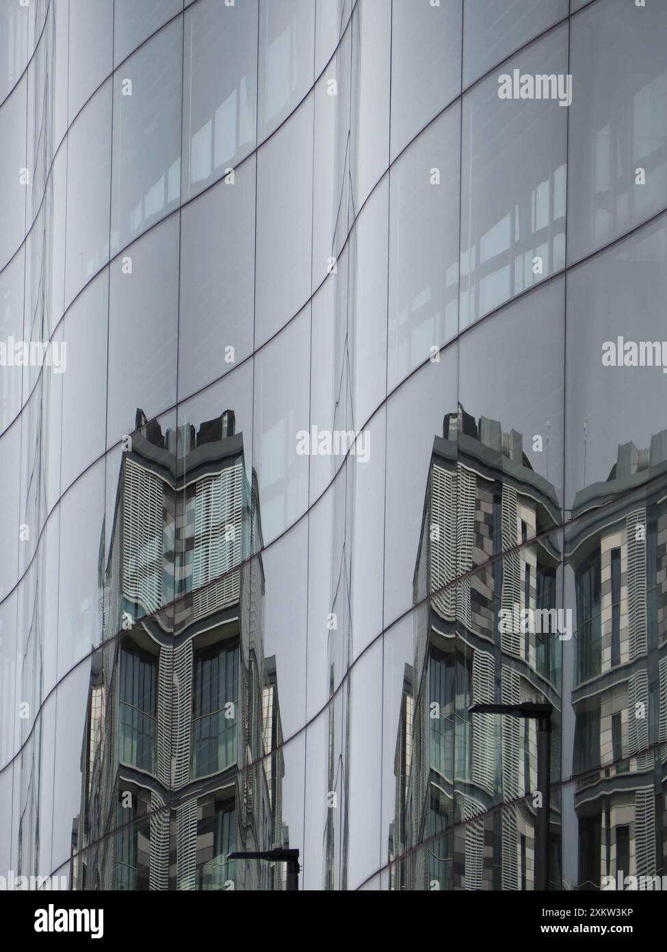 Reflections in a glass window office building sharing modern ...