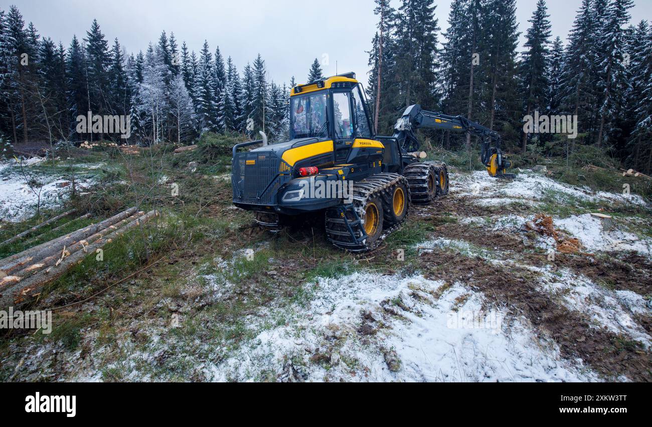 Ponsse Ergo forest harvester at clear cutting area at spruce fir tree ...