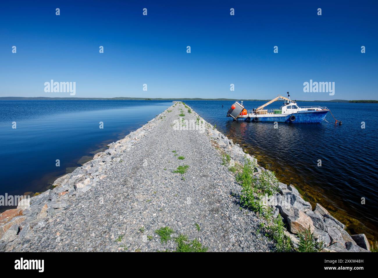 Small Finnish inland lake fishing trawler anchored behind breakwater at ...