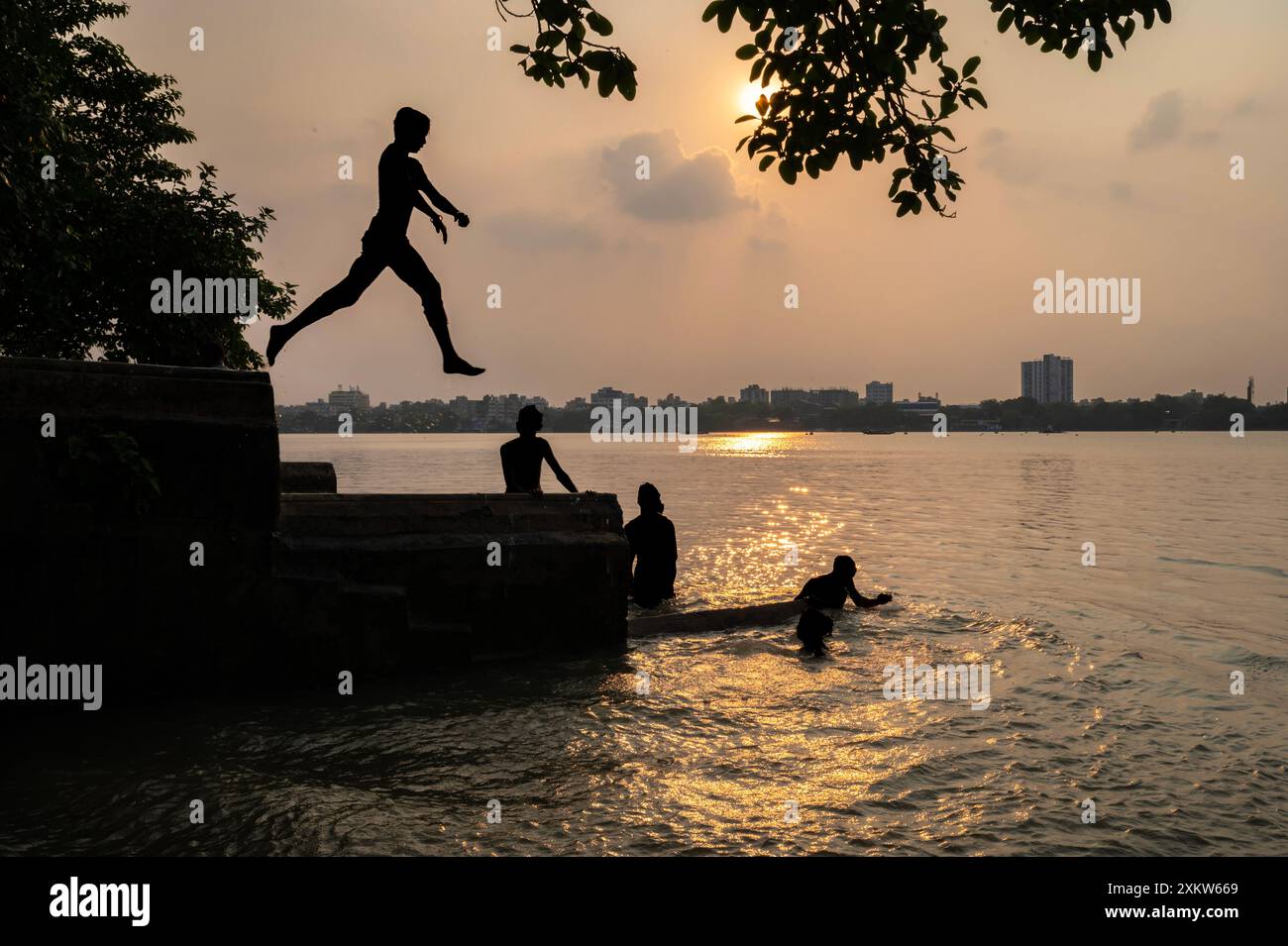 Children jumping into the river hi-res stock photography and images - Alamy