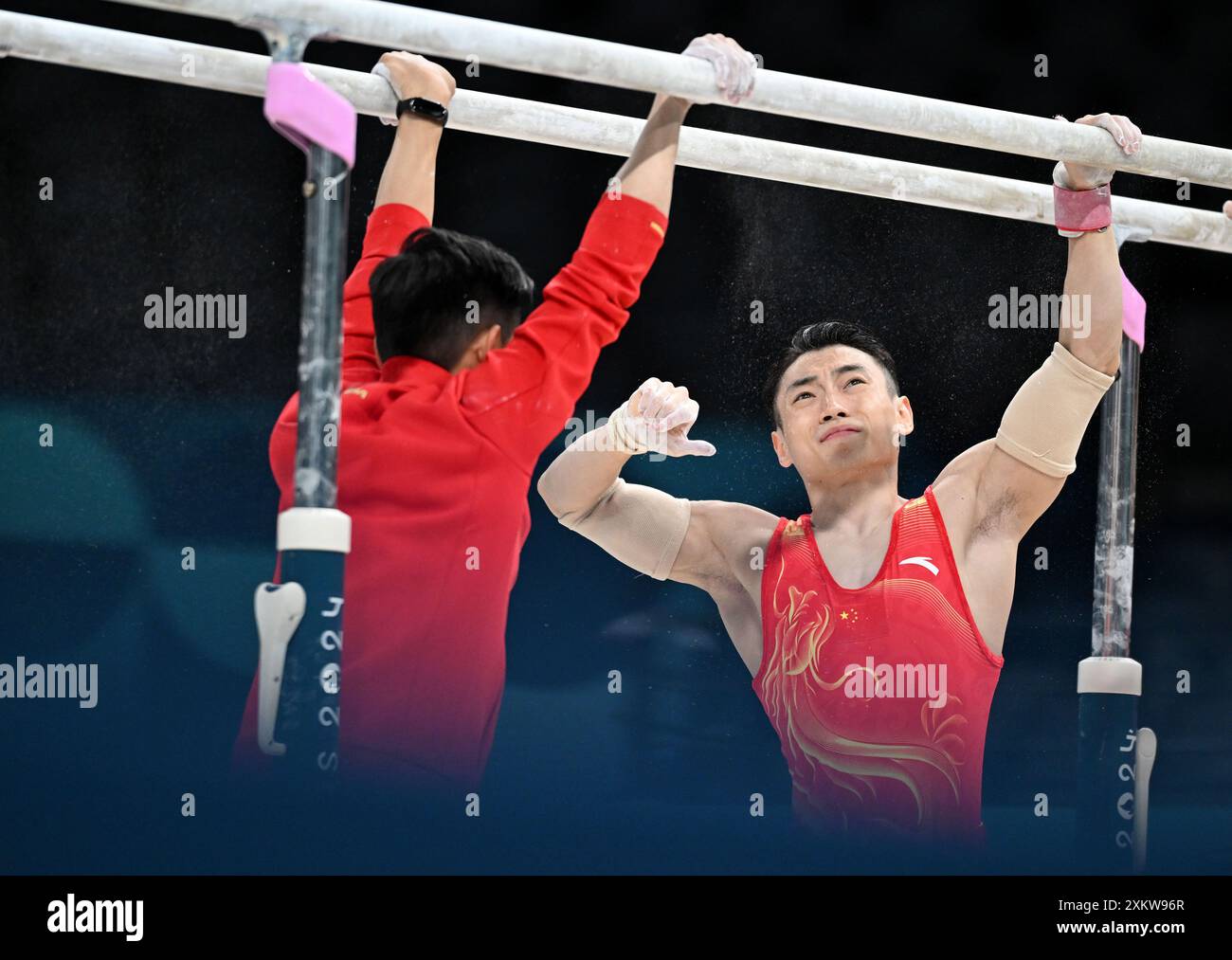 Paris, France. 24th July, 2024. Zou Jingyuan (R) of the Chinese men's ...