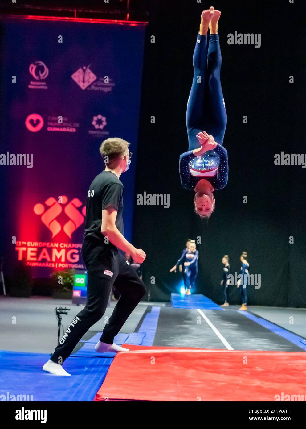 indoor somersault by a female gymnast whose athlete was upside down in ...