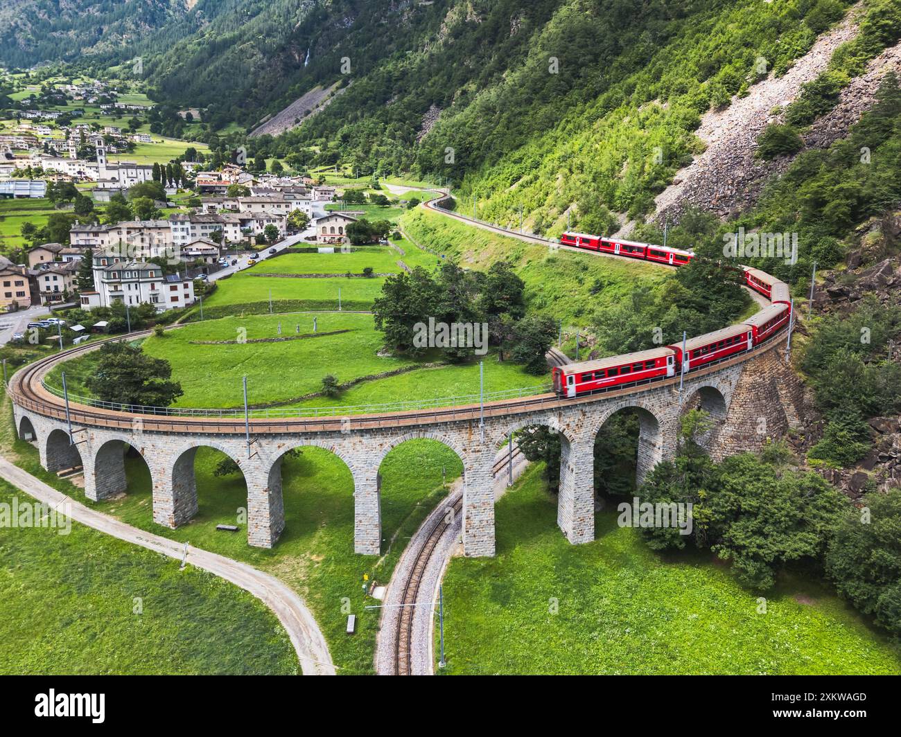 Aerial view of a Bernina Express train crossing the Brusio spiral ...