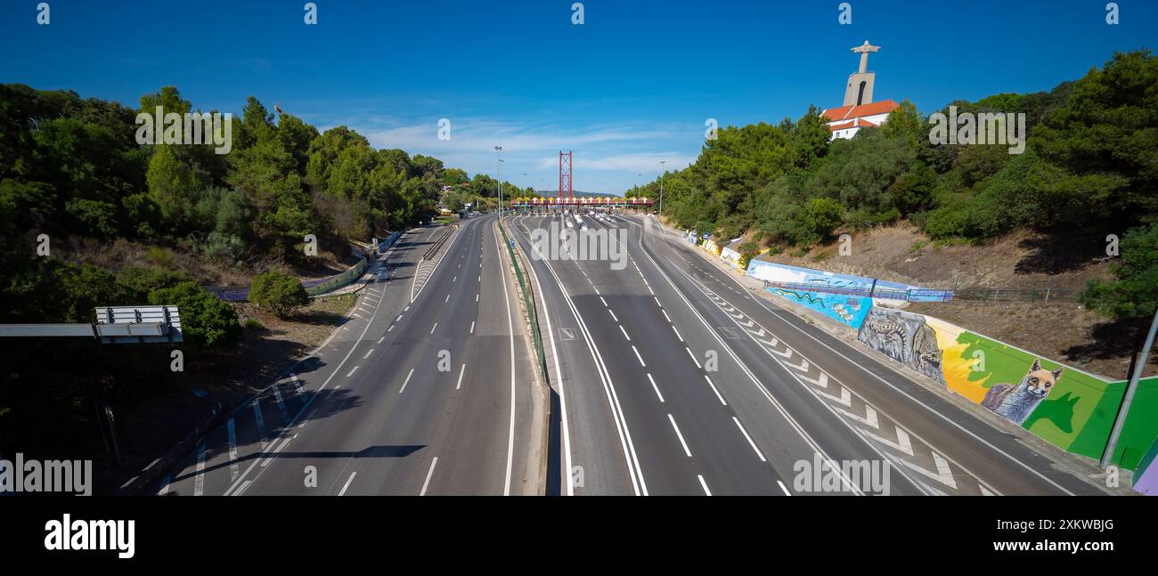 Access road to the bridge and tolls on the 25 de Abril bridge seen from ...
