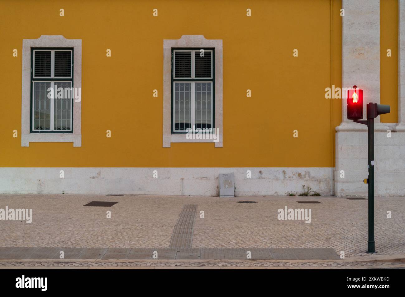 Red pedestrian traffic light with stationary indication on the right ...