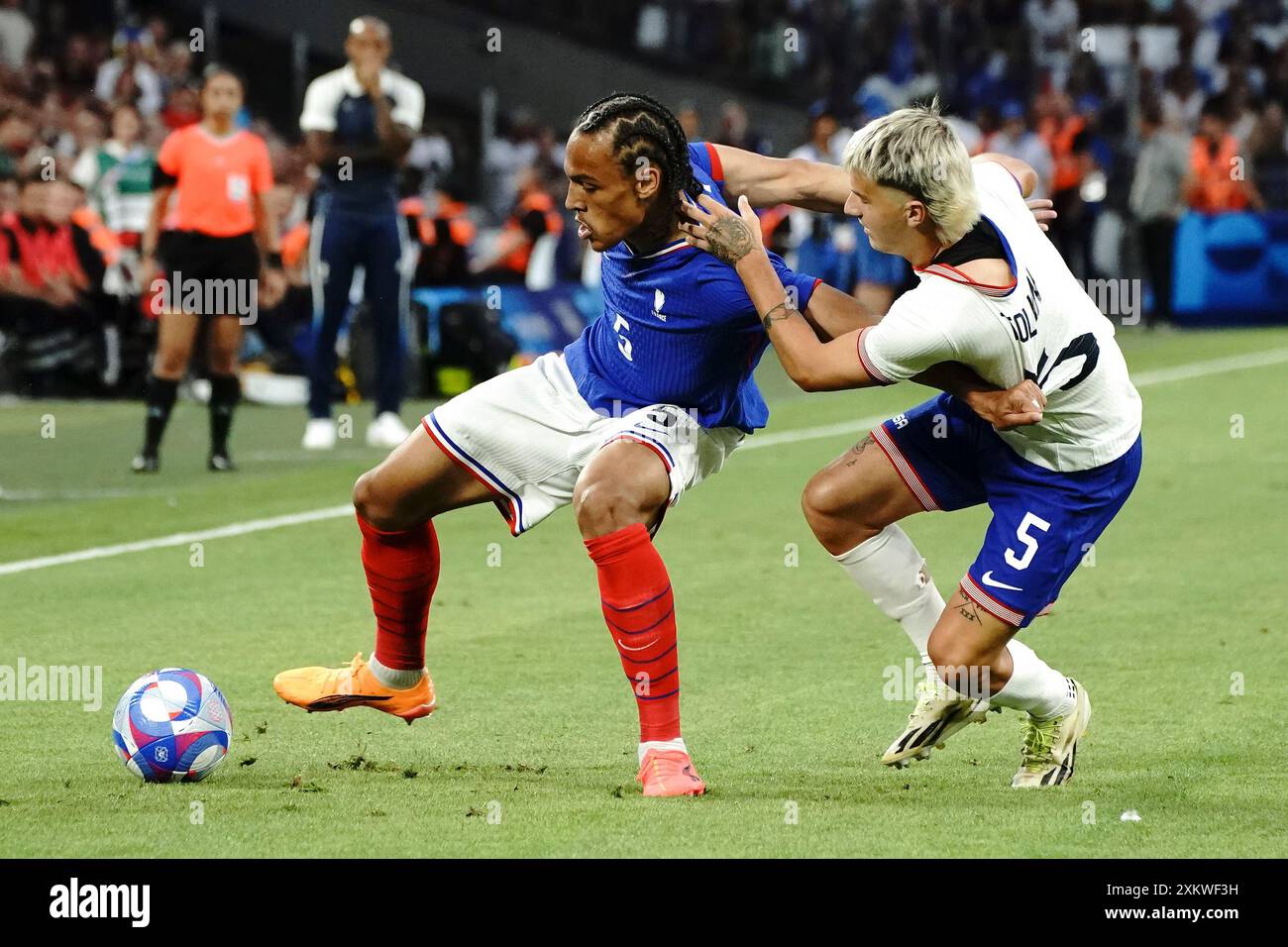 Kiliann Sildillia (France) and John Tolkin (USA) during the Football, Men's Group A, between ...